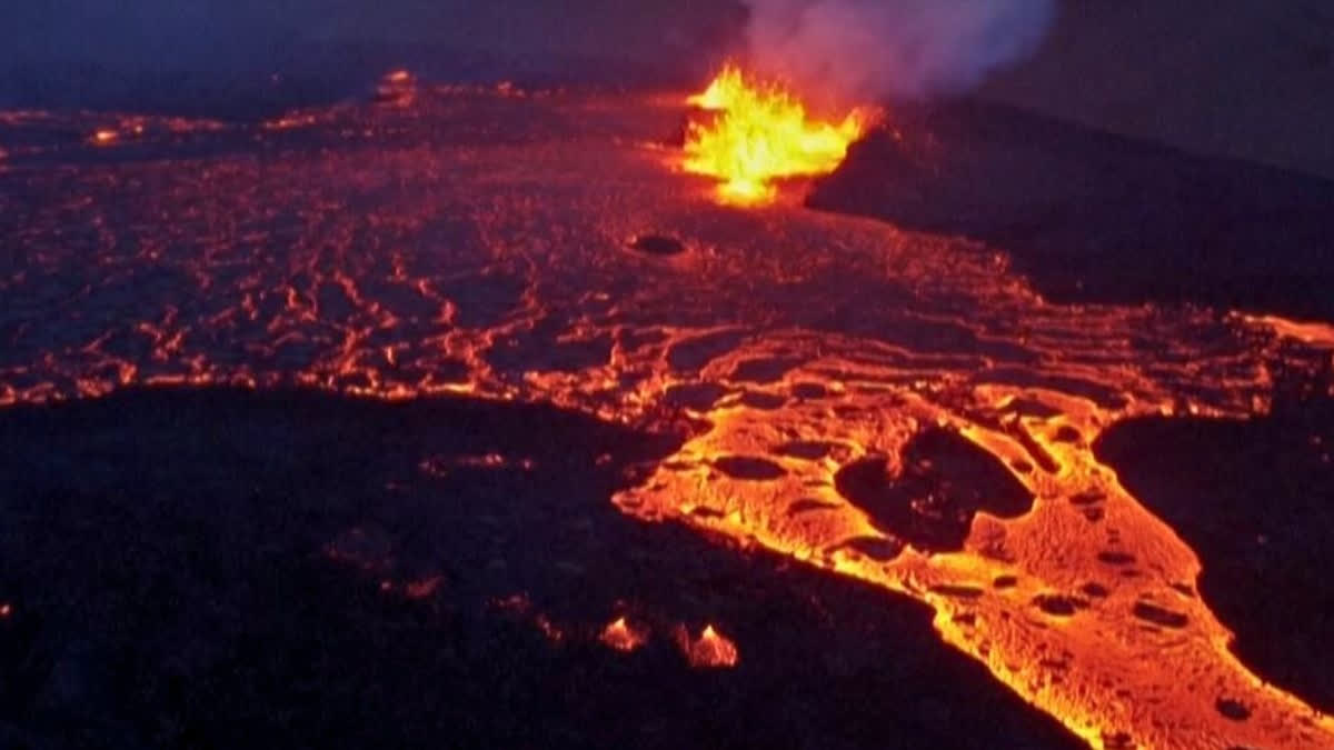 Lava flows out of a fissure in a valley near Mount Fagradalsfjall in ...